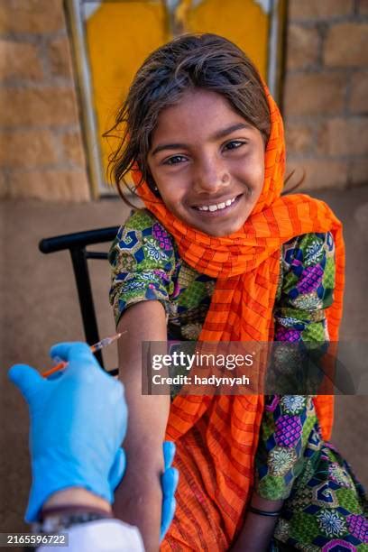 Female Doctor Is Doing An Injection To Young Indian Girl In Small