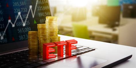 Premium Photo Laptop With Exchange Trade Funds Text And Coins