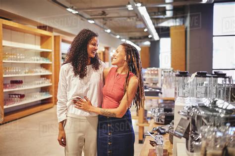 Happy Lesbian Couple Shopping In Home Decor Shop Royalty Free Stock