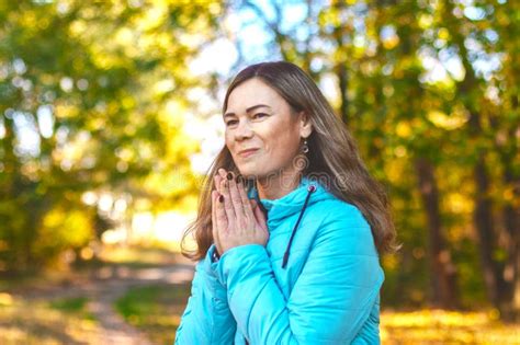 The Girl Rubs Her Hands With Pleasure She Is Wearing A Jacket And Is