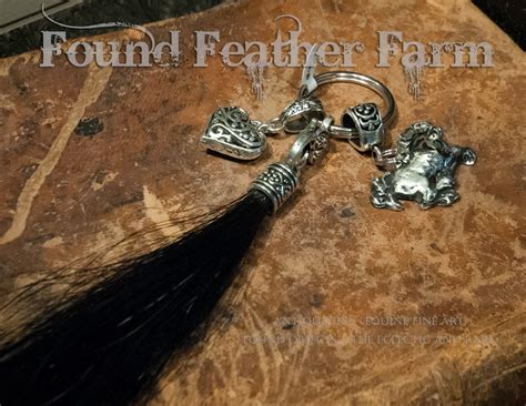 Black Horsehair Tassle Key Ring With Pewter Charms And Hearts