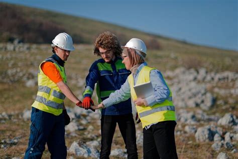 Premium Photo Engineers Collaborating In The Field To Inspect And