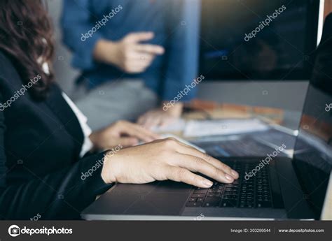 Two Software Developers Are Analyzing Together About The Code Wr