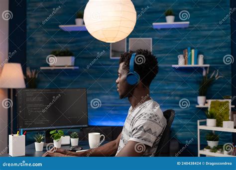 Programmer Man Wearing Headphones Typing Binary Code For Website