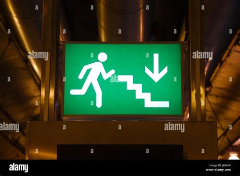 Emergency Exit Sign Glowing In The Dark Stock Photo Alamy