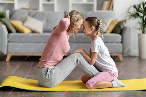 Premium Photo Happy Mother And Little Daughter In Sportswear Training