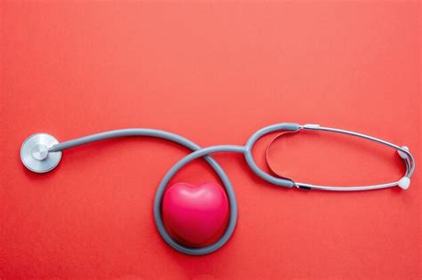Premium Photo Stethoscope On Red Background Health Checkup Cardio Diagnosis Concept
