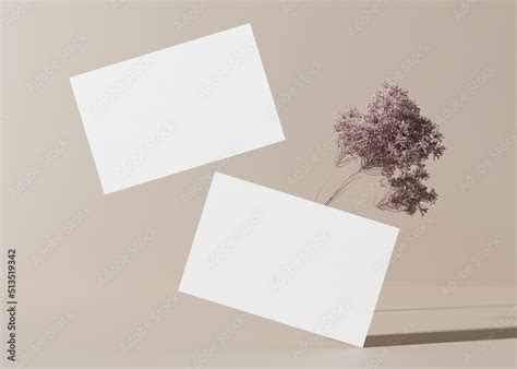 Blank White Business Cards With Small Sprig On Brown Background