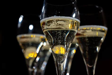 New Year Party Small Bubbles Of Brut Champagne Cava Or Prosecco Wine In Tulip Glasses With