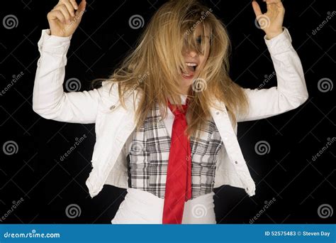 Excited Blond Female Model With Messy Hair And Hands Up Stock Image