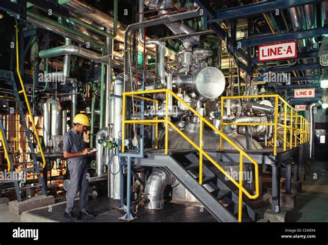 HMA Engineer Taking A Reading In Chemical Factory Plant Stock Photo Royalty Free Image