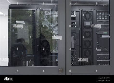Software Engineer Working On A Laptop Computer In A Modern Server Room Monitoring Room Big Data