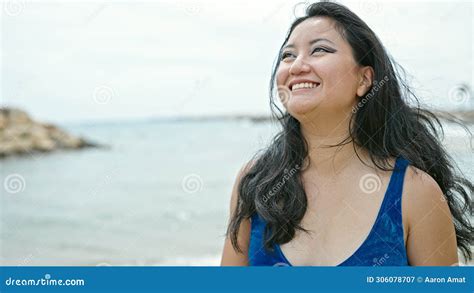 Young Chinese Woman Tourist Smiling Confident Wearing Bikini At The
