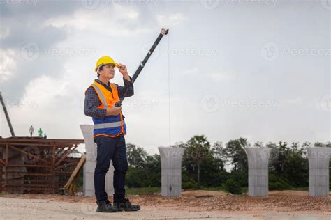 Foreman Worker Checking Project At Building Site Engineer And Builders In Hardhats On