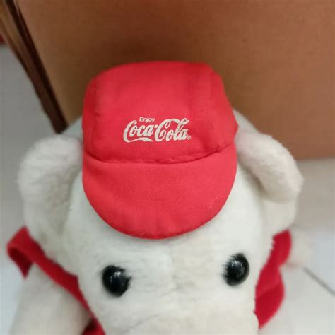 کمدا قیمت و خرید عروسک خرس کوکا کولا ابعاد متوسط رنگ قرمز و سفید