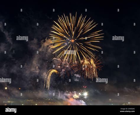 Bright Firework Sparkles In The Dark Sky Small City Celebrating With