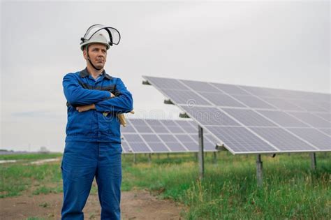 Service Engineer Man Standing With Arms Crossed In Front Of Solar