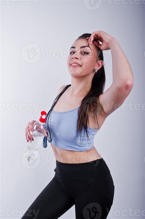 Wet Cheerful Attractive Young Fitness Woman In Top And Black Leggings