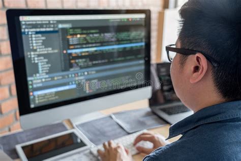 Young Professional Programmer Working At Developing Programming And Website Working In A
