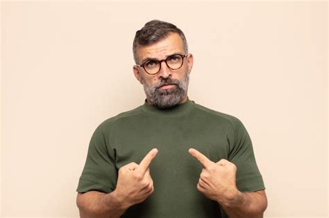 Premium Photo Adult Handsome Man Pointing To Self With A Confused And Quizzical Look Shocked