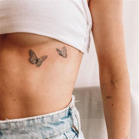 Butterfly Tattoo In Between Breast