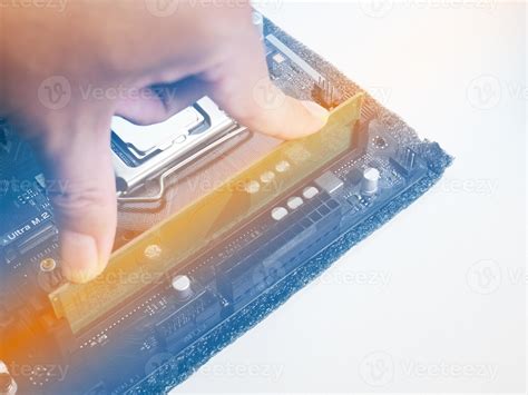 Use Your Finger To Press The RAM Into The RAM Slot On The Motherboard