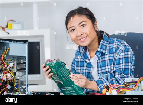 Woman Fixing A Computer Hard Drive Stock Photo Alamy