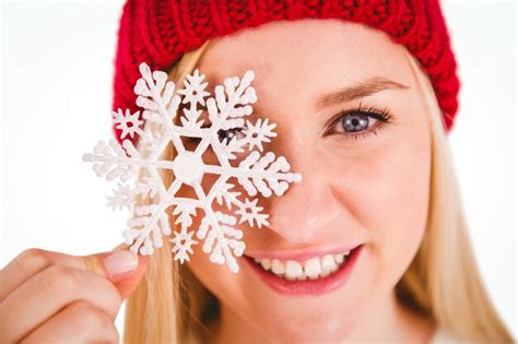 Premium Photo Festive Blonde Holding Snowflake Decoration