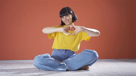 Woman Making Heart Symbol For Camera Stock Video At Vecteezy