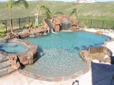 Waterfall Slide Grotto And Sunken Bar Tropical Swimming Pool
