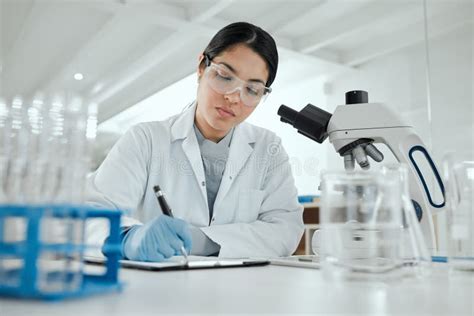 Proving My Hypothesis Correct A Young Woman Making Notes In Her Lab