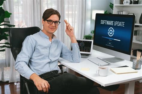 Smiling It Looking Camera With Software Update Loading On Pc Pecuniary