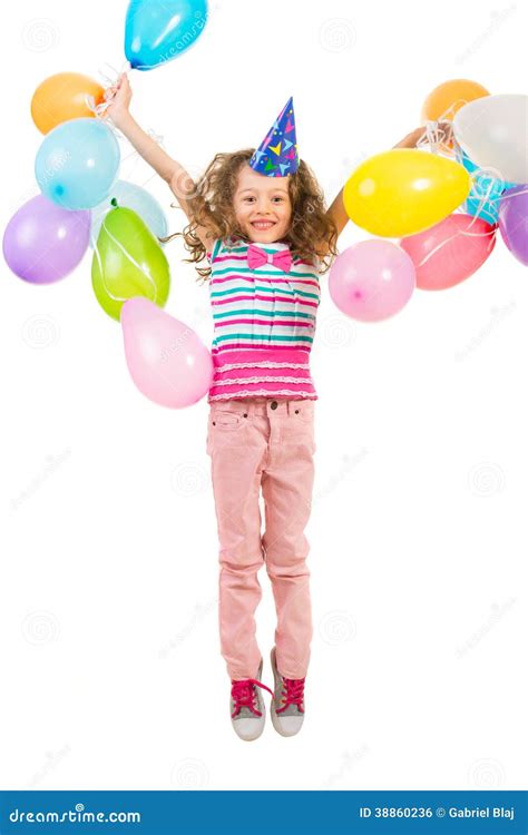 Счастливая радостная девушка скача с воздушными шарами Стоковое Фото изображение насчитывающей