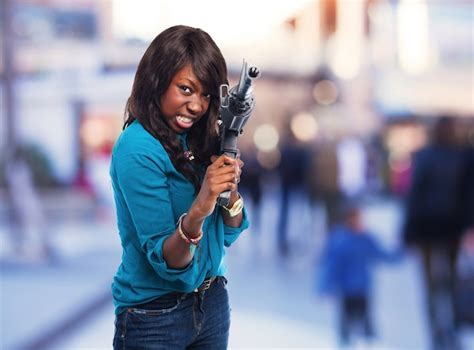 Free Photo Woman Pointing With A Machine Gun