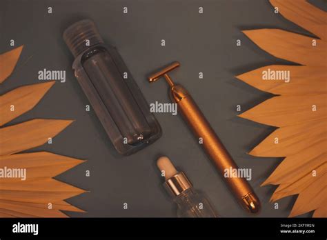 Vibrating Golden Facial Massager Glass Jar With Oil Dropper For