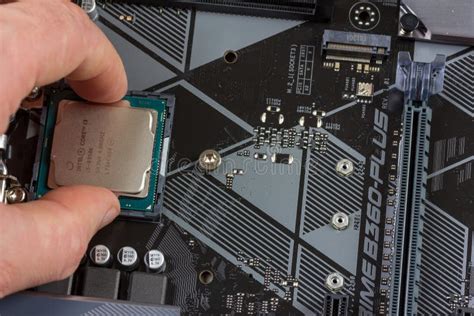 Man Installs An Th Generation Intel Core I Processor Into A Motherboard Socket Editorial