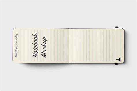 Free Open Notebook With Rubber Mockup Mockupbee