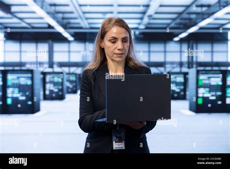 Technician In Data Center Implementing Backup Solutions To Protect