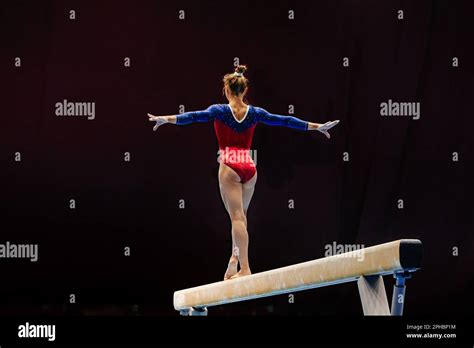 Back Female Gymnast Athlete Balancing On Balance Beam Gymnastics
