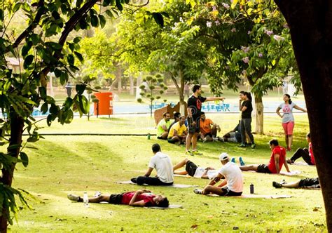Young People Enjoying An Exercise Class In The Park Editorial Image