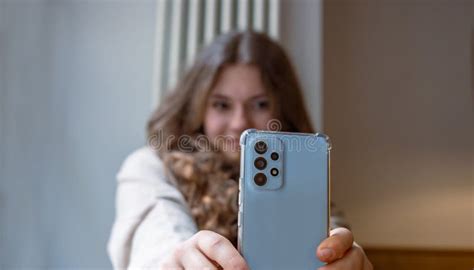Beautiful Teenager Girl With Long Hair Taking Selfie With Mobile Phone