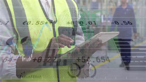 Man Wearing Safety Vest Holding Tablet Monitoring Inventory In