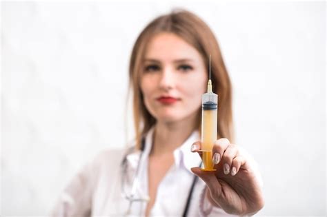 Premium Photo Female Caucasian Doctor Squirting Liquid Pretty Slim