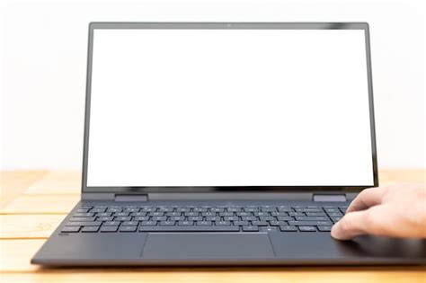 premium photo hand operating the numeric keypad of a laptop with the blank screen available