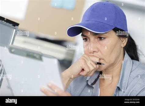 Female Engineer Reading Project Plan Stock Photo Alamy