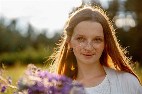 Close Up Portrait Of Young Beautiful Redhead Woman With Freckles