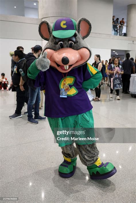 A Cosplayer Dressed As Chuck E Cheese Poses During The 2024 New York
