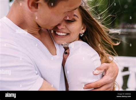 Guy Hugging His Girlfriend Stock Photo Alamy