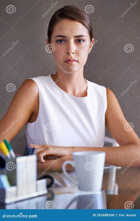 Taking Her Job Seriously Gorgeous Businesswoman Sitting At Her Desk