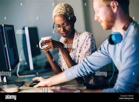 Software Engineers Working On Project And Programming In Company Stock